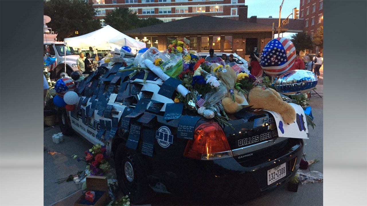 Parents teach lessons at memorial for fallen Dallas officers | ksdk.com